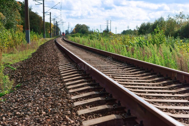 Rails Stretching into the Distance, Turn at the Railroad Stock Photo ...