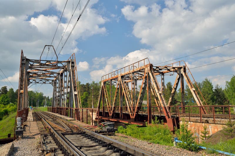 Railway Bridge Across the River and the Rails with the Arrow in Stock ...
