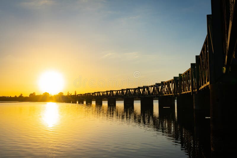Railway bridge at sunrise stock image. Image of horizon - 239608607