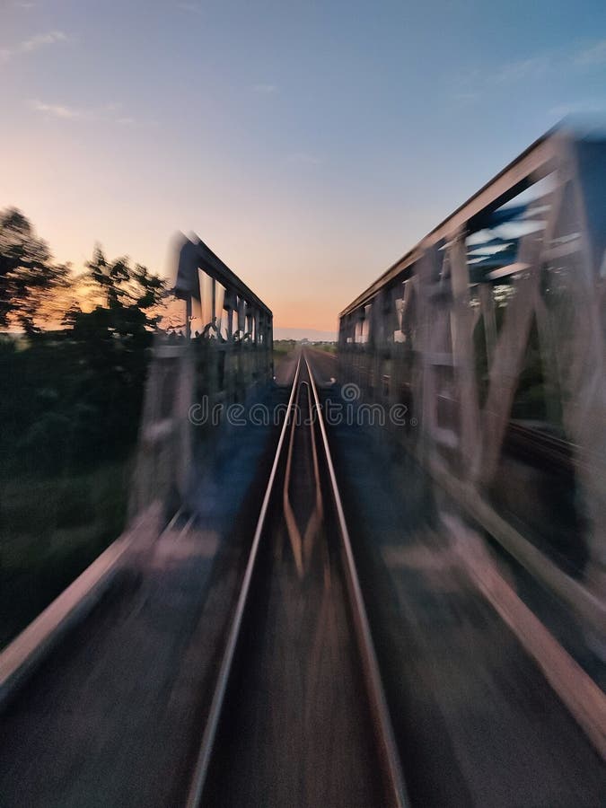 Railway bridge and sunrise stock photo. Image of reflection - 261630374