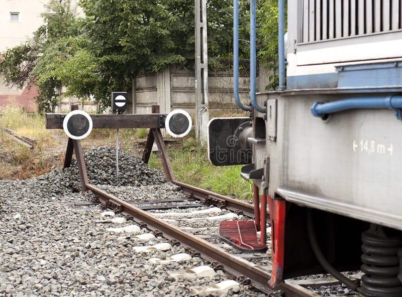 A Buffer Stop and Warning Lights at the End of a Train Track Stock ...