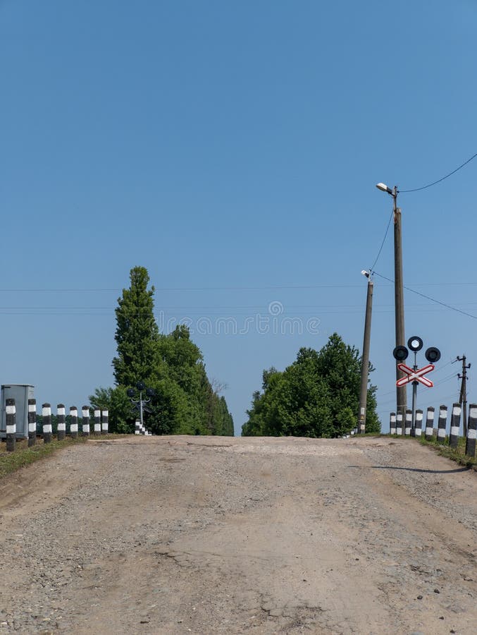 Railway Crossing with a Sign and Semaphore on a Dirt Rural Road Stock ...