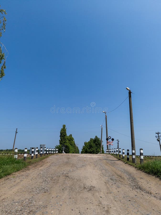 Railway Crossing with a Sign and Semaphore on a Dirt Rural Road Stock ...
