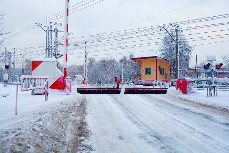 Railway Crossing in Winter, with Raised Barriers Anti-RAM Devices Stock ...