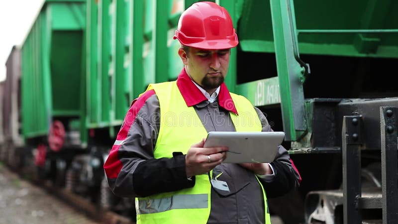 Railwayman with Tablet Pc Near Freight Train Stock Footage - Video of ...