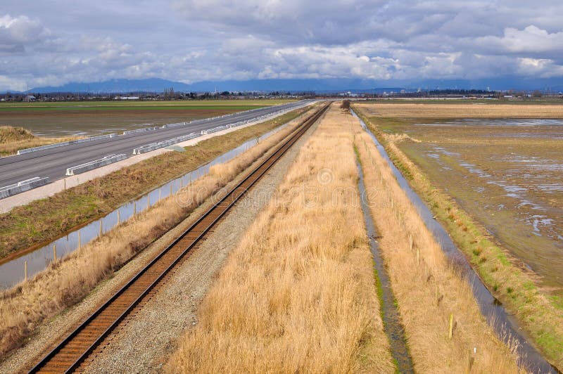 Railway and Highway by Farm Fields Stock Image - Image of landscape ...