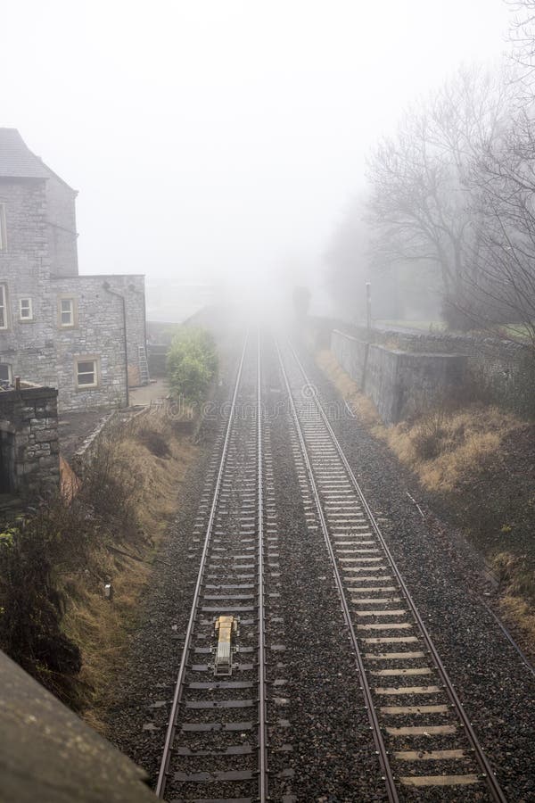 Railway Lines and mist stock photo. Image of converging - 85608338