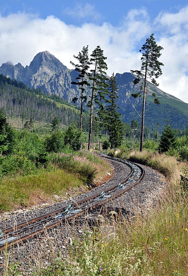 Railway in the mountains stock photo. Image of white - 60773848