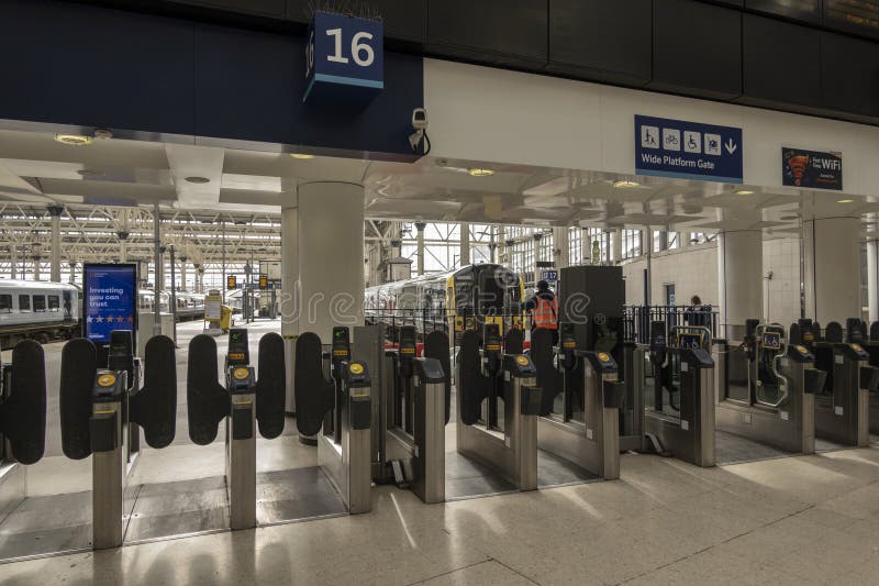 Railway Passenger Entering and Exiting Gates on Platform 6. London, UK ...