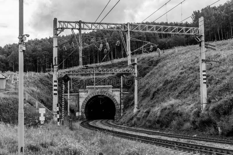Railway, Path with a Tunnel in Hills with Trees, Wire Pillars, Clouds ...