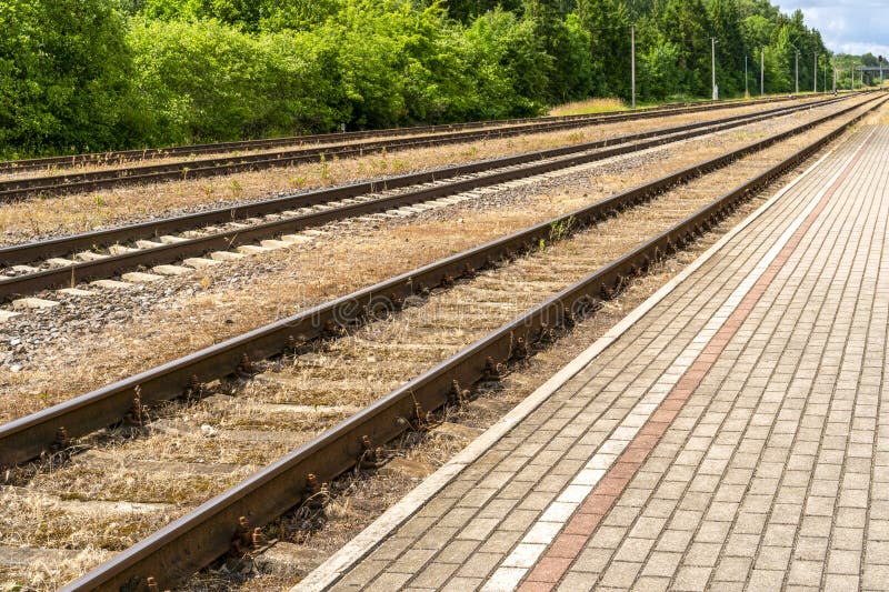 Railway Platform with Paving Stones and Empty Tracks Stock Photo ...