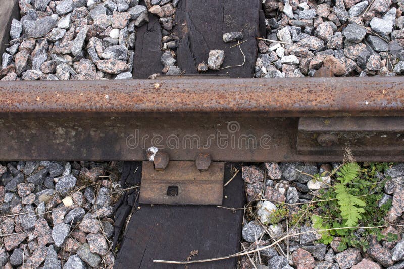 A Railway with Rails and Concrete Sleepers.Background of an Old Rusty ...
