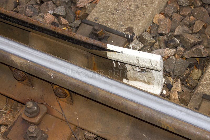 A Railway with Rails and Concrete Sleepers.Background of an Old Rusty ...