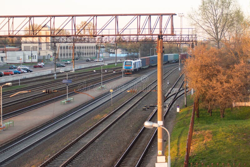 Railway Station with a Lot of Tracks and a Moving Train Stock Photo ...