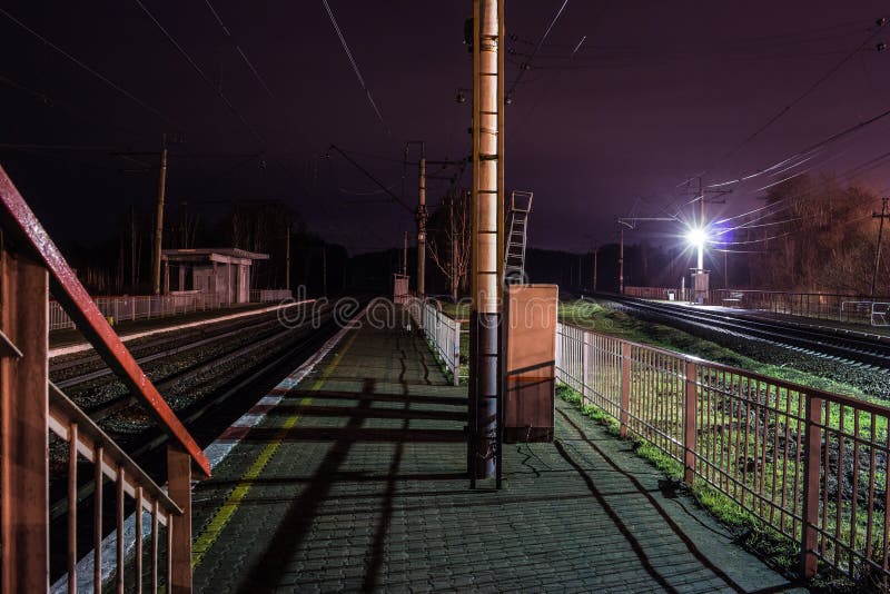 Railway Station at Night with a Passing Train Stock Image - Image of ...