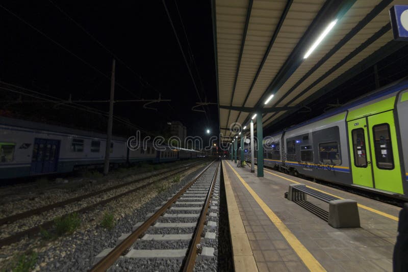 Railway Station with Train Waiting on the Tracks at Night Editorial ...