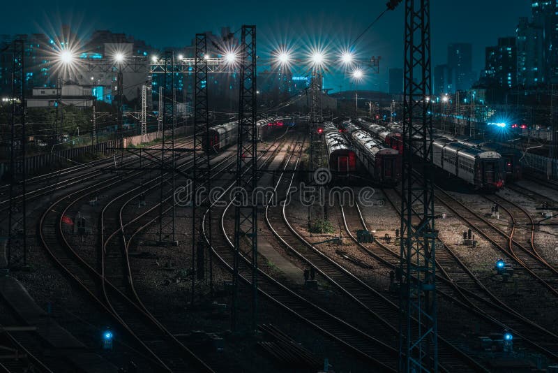 Railway Station with Trains at Night Stock Photo - Image of industrial ...