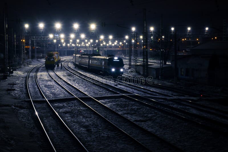 Railway Station with Trains at Night in Blue Stock Image - Image of ...