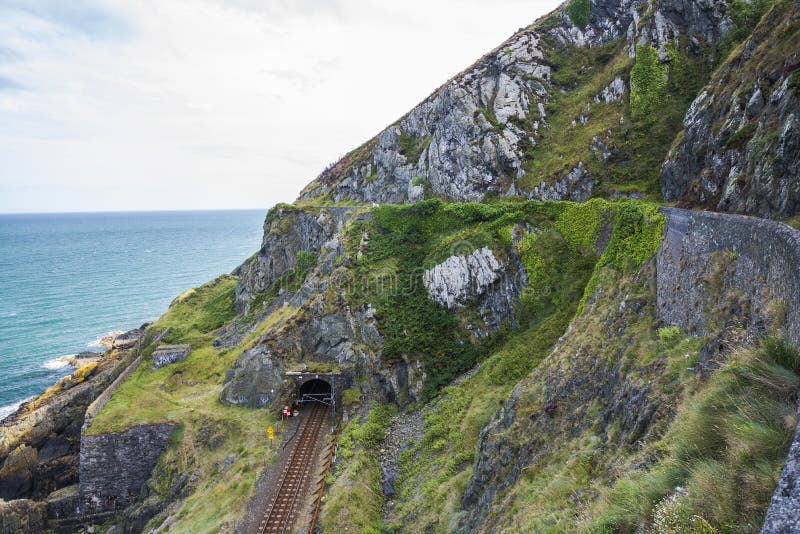 Railway through Stone Rocks Mountain at Irish Seacoast Stock Image ...