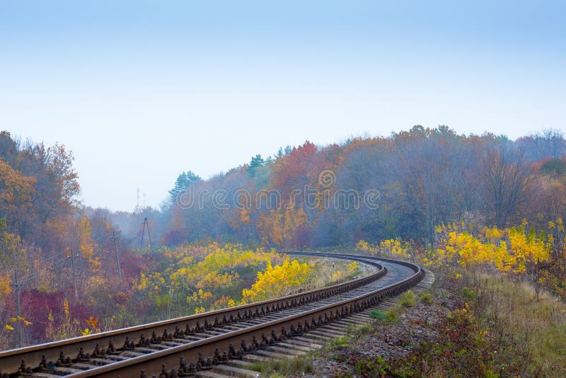 The Railway Track among Colorful Trees in the Fall_ Stock Image - Image ...