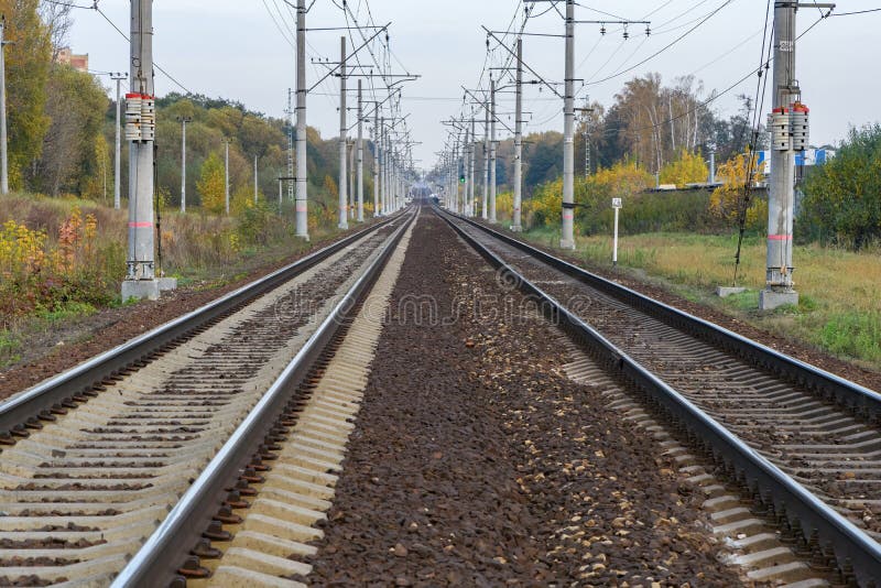 Railway Track with Electricity Pylons in Perspective View Go into the ...