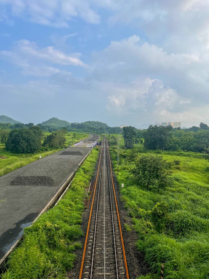 Railway Track with Grass, Mountain and Cloud Stock Photo - Image of ...