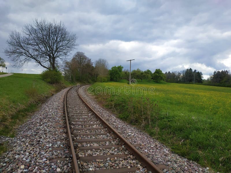 Railway Track Running through Rural Landscape in Germany Stock Photo ...