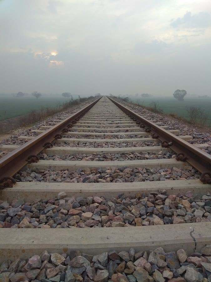 Railway Track in Village stock photo. Image of sunrise - 111311056