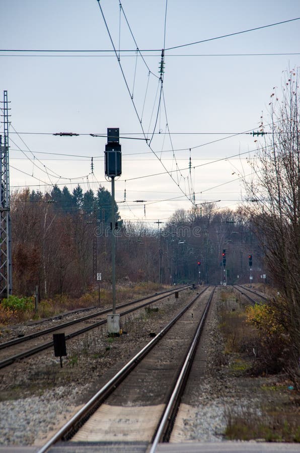 Railway Tracks with Overhead Lines and Red Traffic Lights in Portrait ... Railway Tracks with Overhead Lines and Red Traffic Lights in Portrait ...