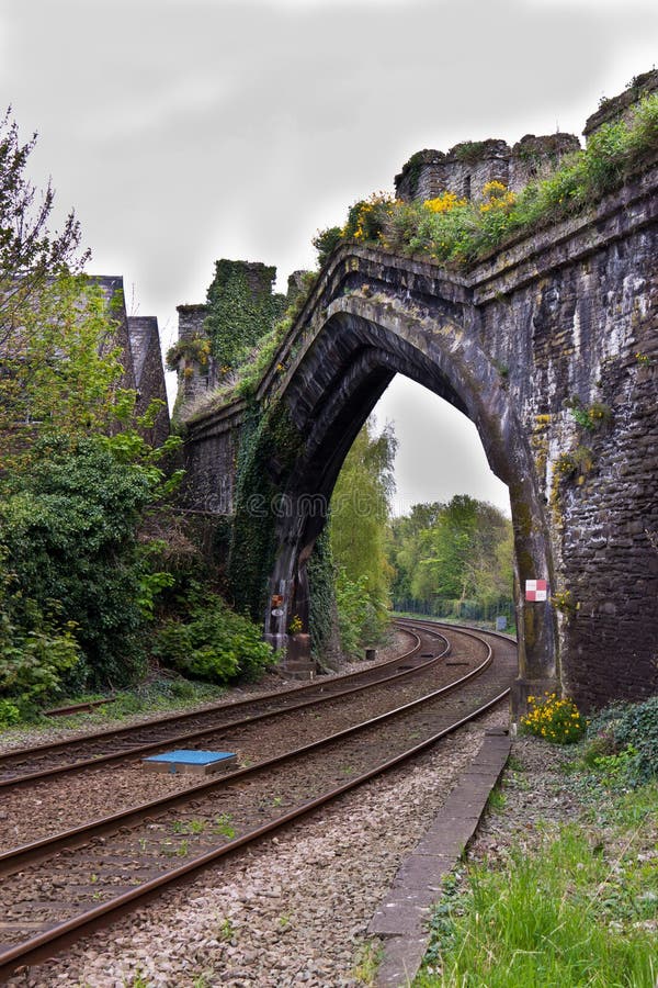 Railway Tracks Passing through Medieval Stone Wall in Conwy, Wal Stock ...