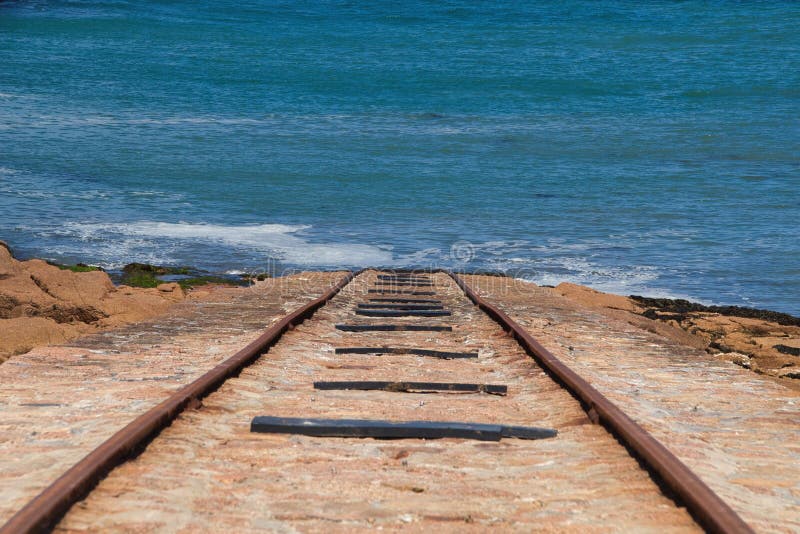 Railway tracks in the sand stock photo. Image of rails - 244316874