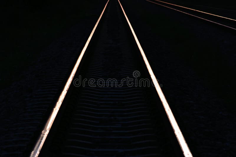 Railway Tracks in the Shadow Light of Sunset. Stock Image - Image of ...