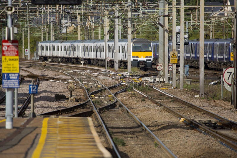 Railway Tracks at a Busy Rail Station Stock Image - Image of overhead ...