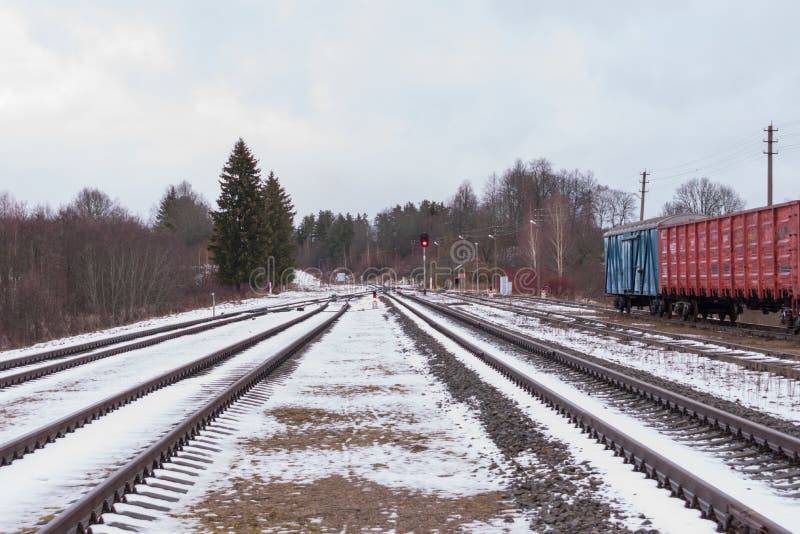 Railroad Tracks in Winter with a Train Stock Photo - Image of travel ...