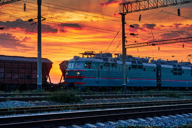 Railway Train and Rail Cars in a Beautiful Sunset, Dramatic Sky and ...