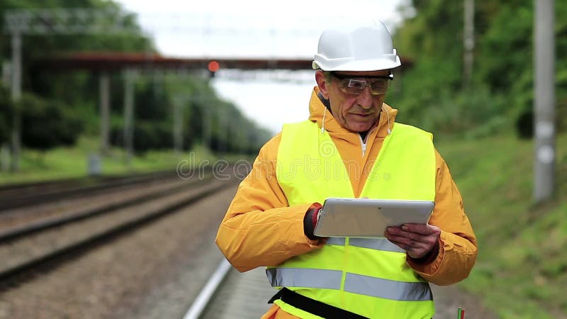 Railway Worker Makes Notes in His Tablet Computer Stock Video - Video ...