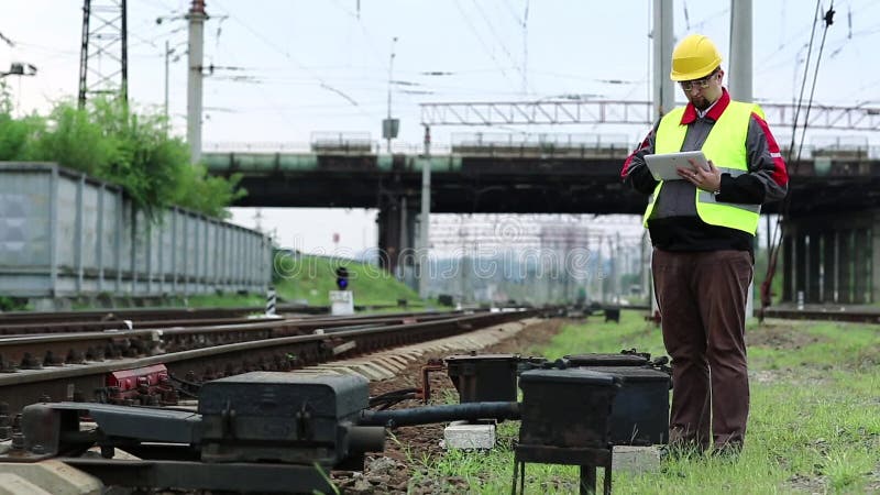 Railway Worker Makes Notes in Tablet Computer Stock Video - Video of ...