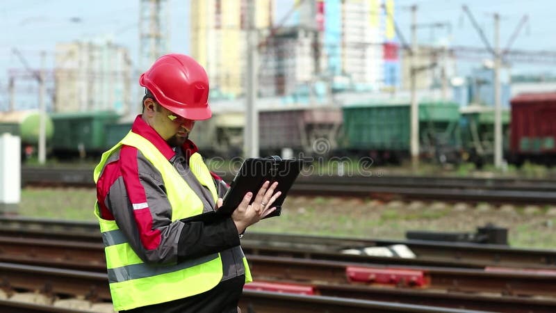 Railway Worker with Tablet Pc at Freight Terminal Stock Video - Video ...