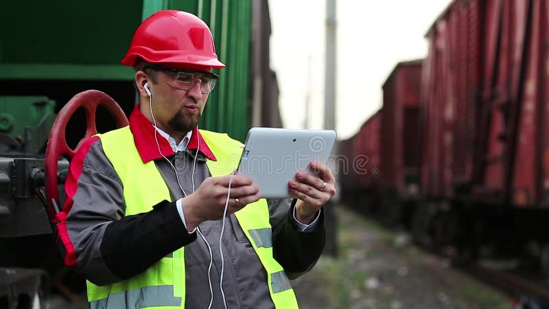 Railway Worker Talks Via Tablet Computer Stock Video - Video of ...