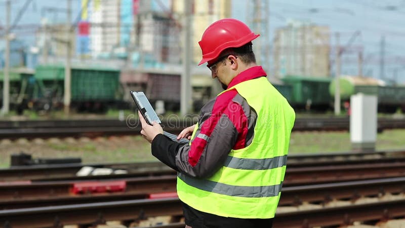 Railwayman with Computer at Freight Train Terminal Stock Footage ...