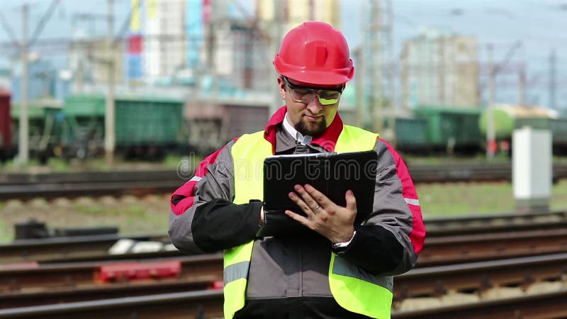 Railwayman with Computer at Freight Train Terminal Stock Video - Video ...