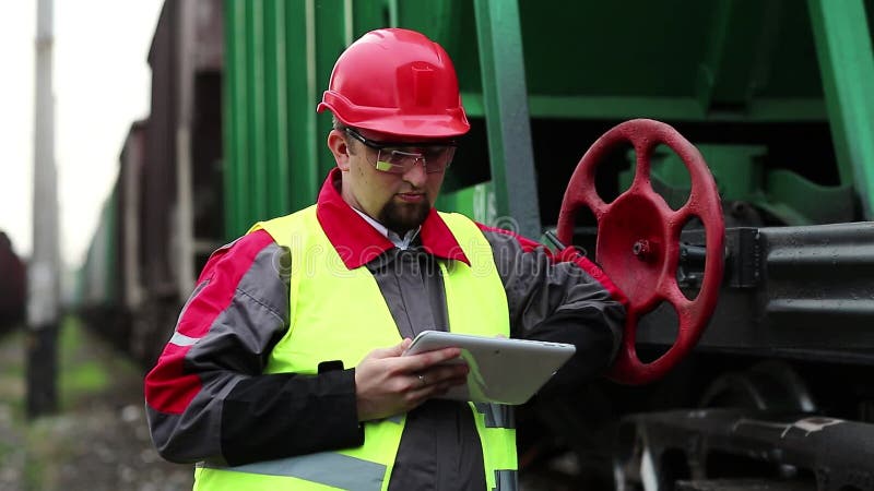 Railwayman with Tablet Pc Near Freight Train Stock Footage - Video of ...