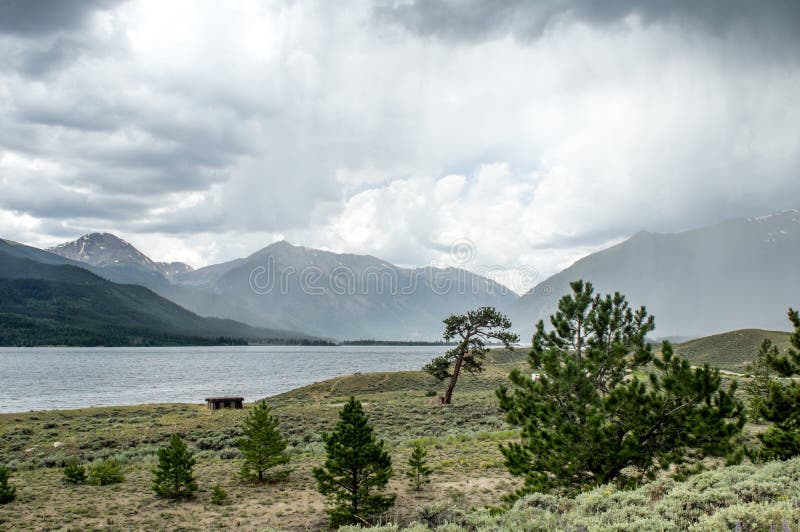 Rain Across the Lake stock image. Image of shrubs, cliff - 101737023