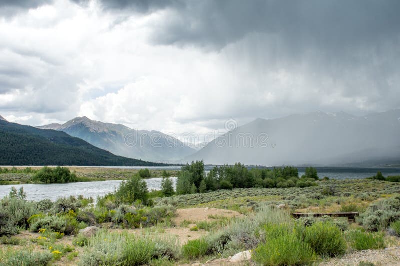 Rain Across the Lake stock photo. Image of mountains - 101737040