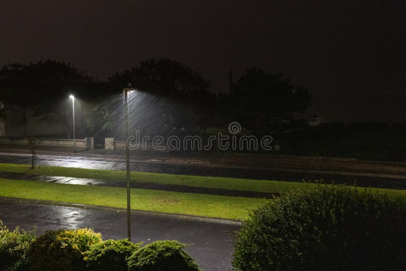 Rain Blown by a Strong Wind Captured in the Light of a Street Lamp at ...