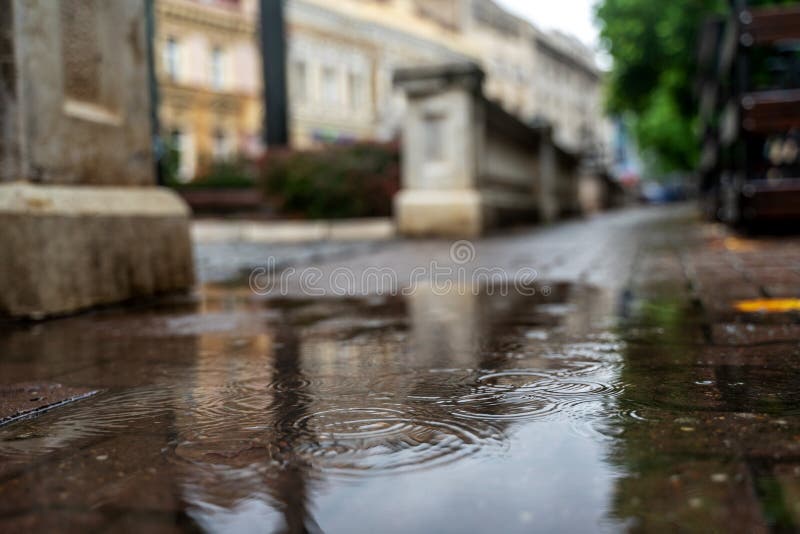 Rain in the City, Drops are Falling. Close-up of the Sidewalk. Urban ...