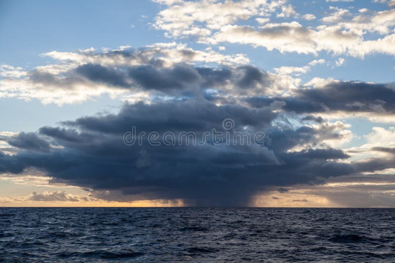 Rain Cloud and Sea stock photo. Image of tropics, water - 41005512