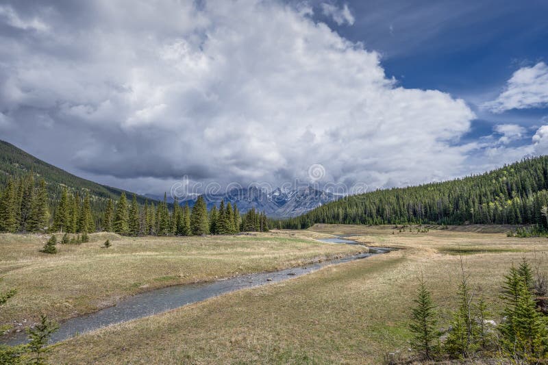 Rain Clouds Over the Cascade River in Banff Stock Image - Image of ...