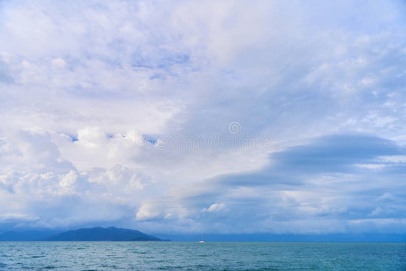 Rain Clouds Over an Island in the Sea. the Rain is Coming Stock Image ...