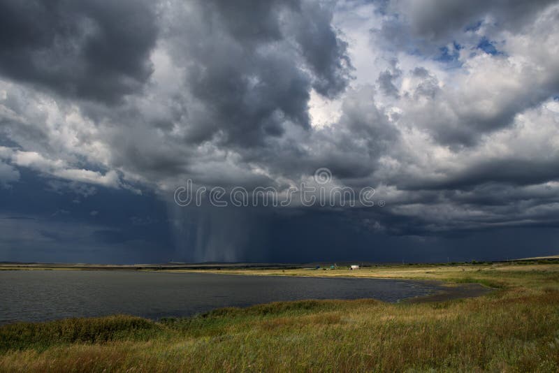 Rain from the Clouds Over a Lake. Stock Image - Image of road, showery ...